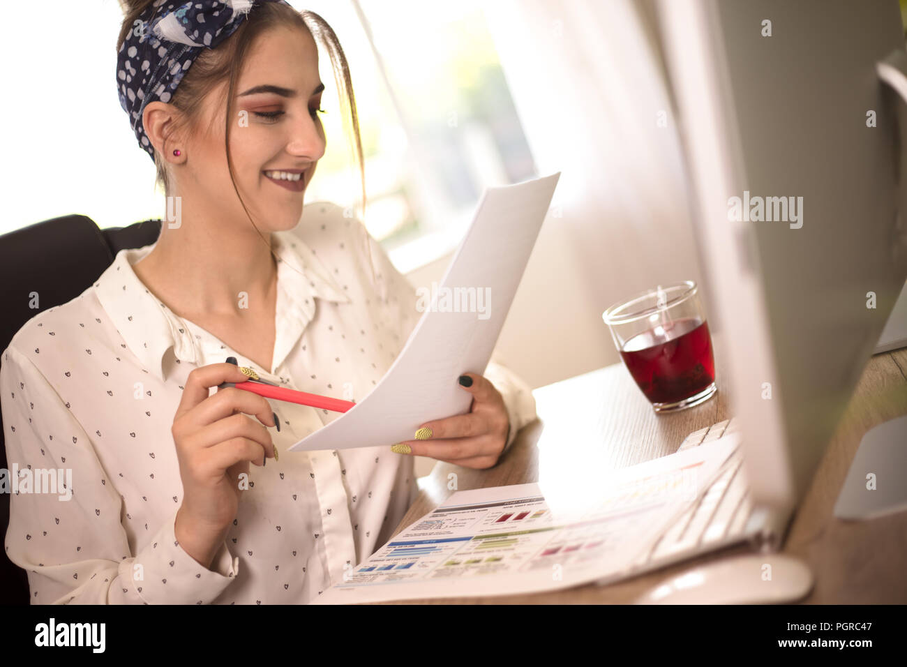 Female graphic designer using pc computer at the office Stock Photo - Alamy