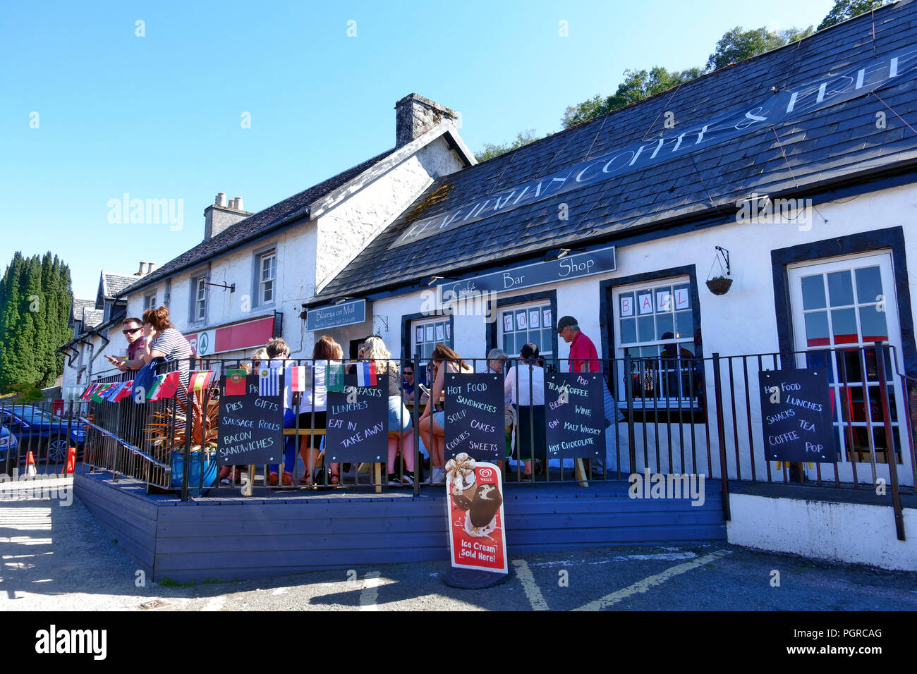 Busy outdoor seating area on a sunny day in the Coffee & Bar which is ...