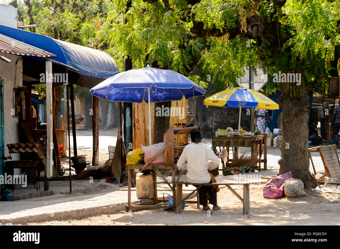 ZIGUINCHOR, SENEGAL - APR 28, 2017: Unidentified Senegalese man sells ...