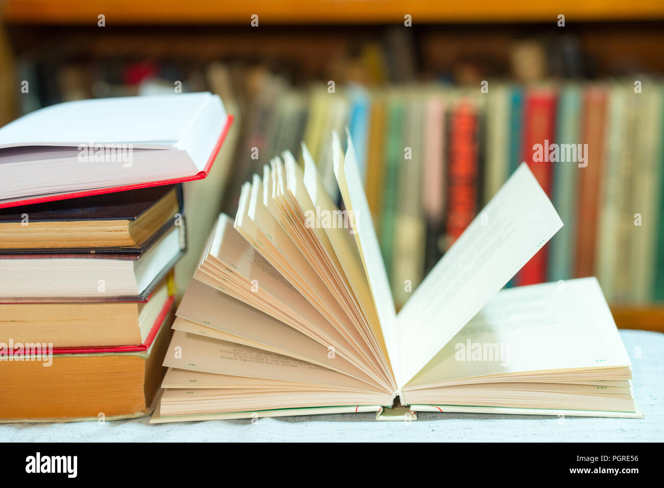 Open Book Stack Of Hardback Books On Table Top View Stock Photo