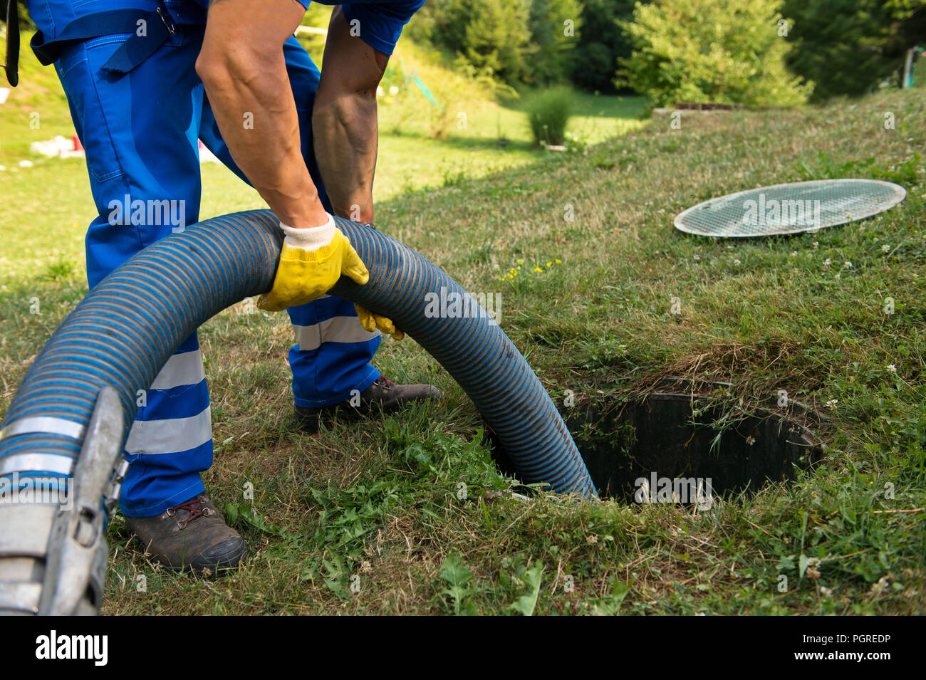 Emptying household septic tank. Cleaning sludge from septic system ...