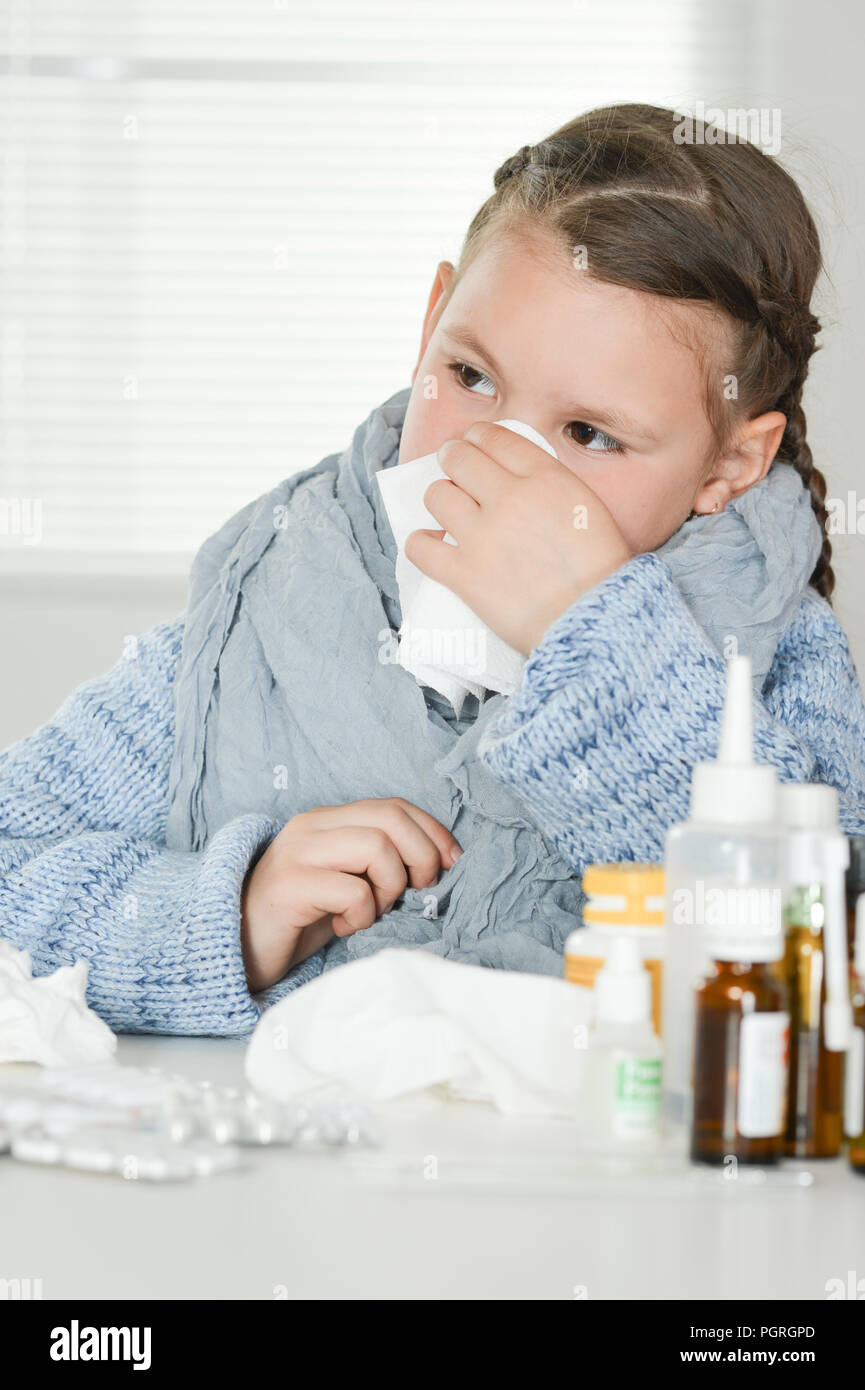 Close up portrait of young sick girl with medicines Stock Photo - Alamy