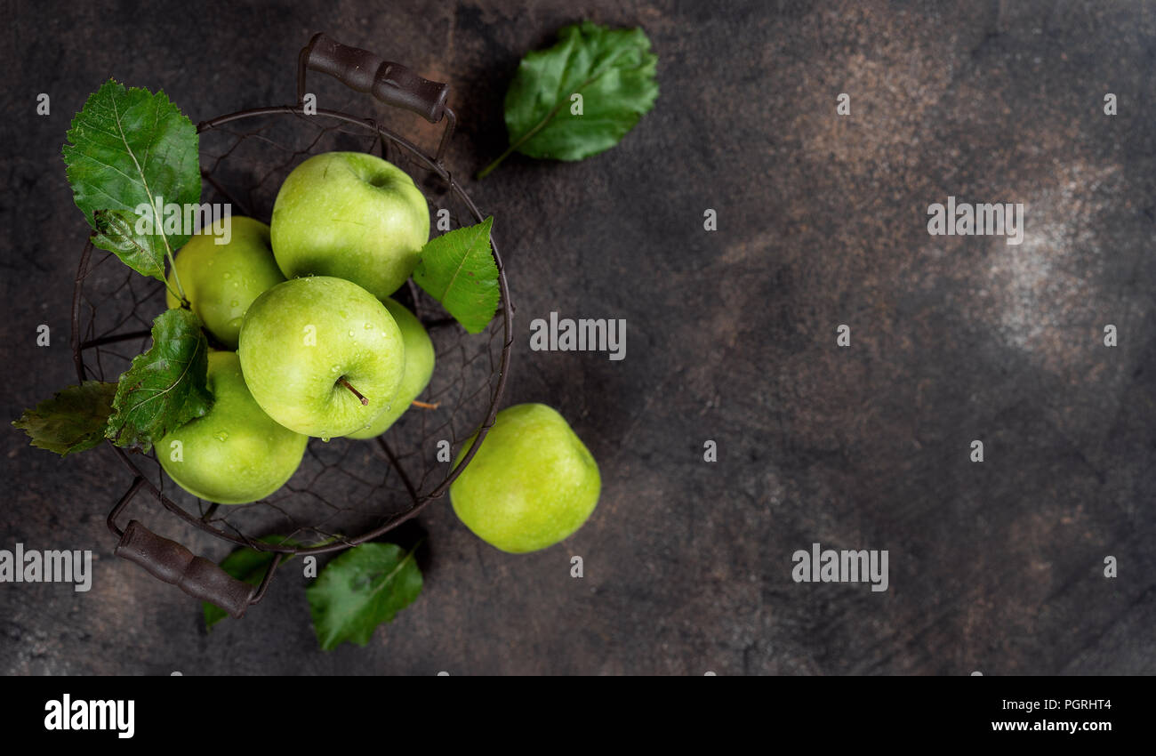 Top view of green apples on rusty background Stock Photo - Alamy