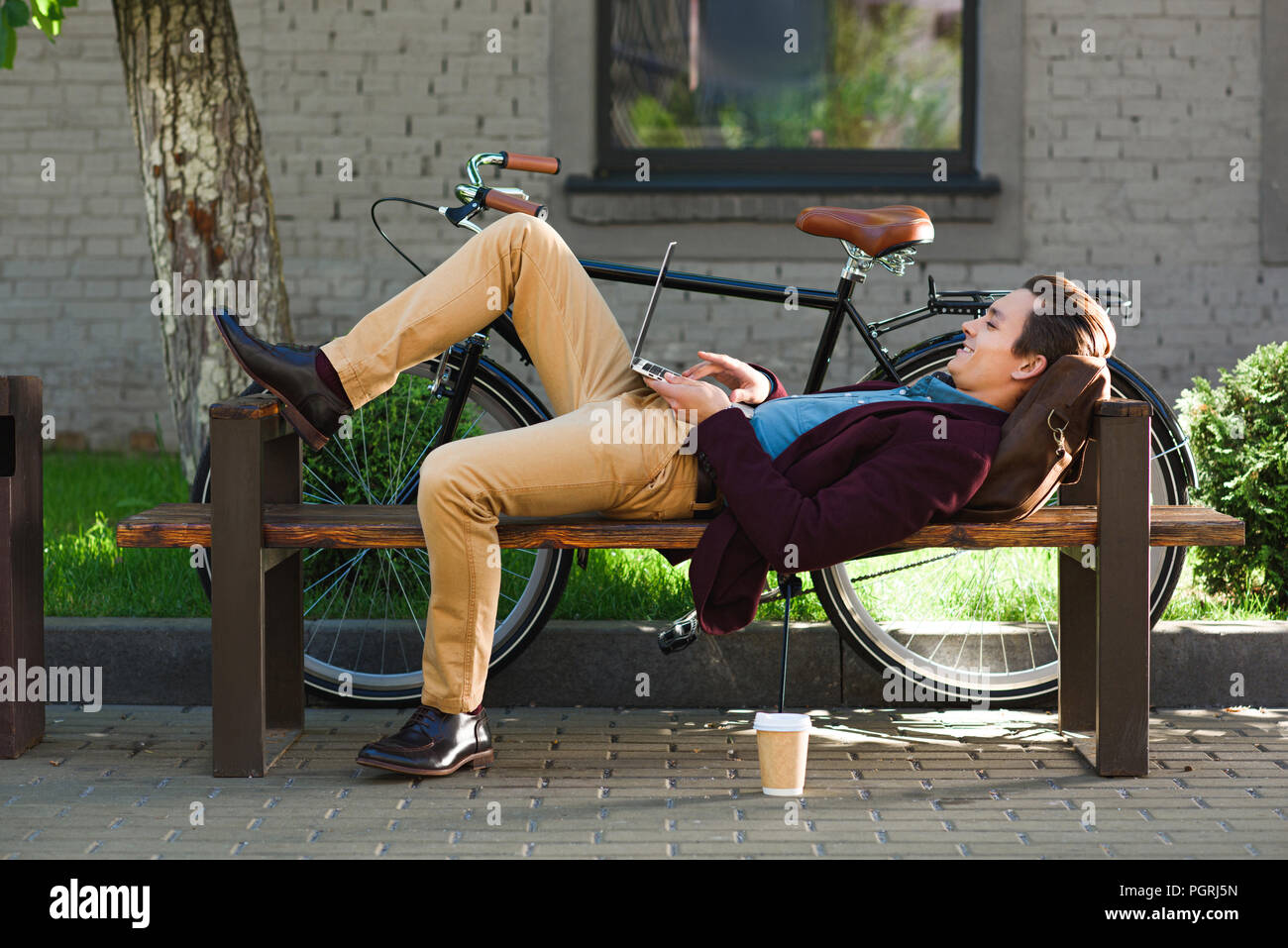 Young man lying on work bench hi-res stock photography and images - Alamy