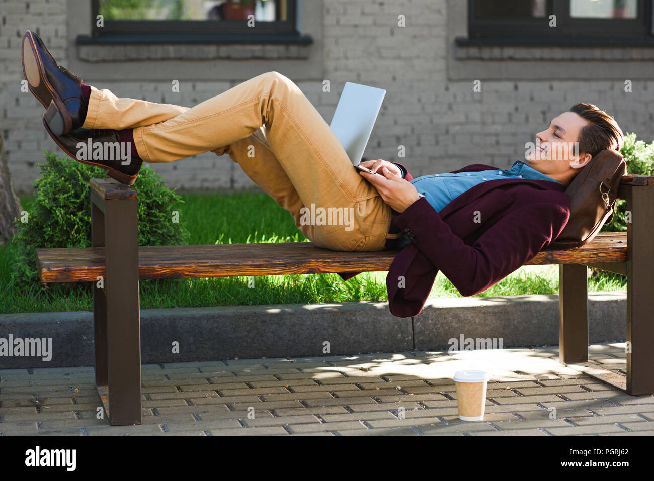 Young man lying on work bench hi-res stock photography and images - Alamy