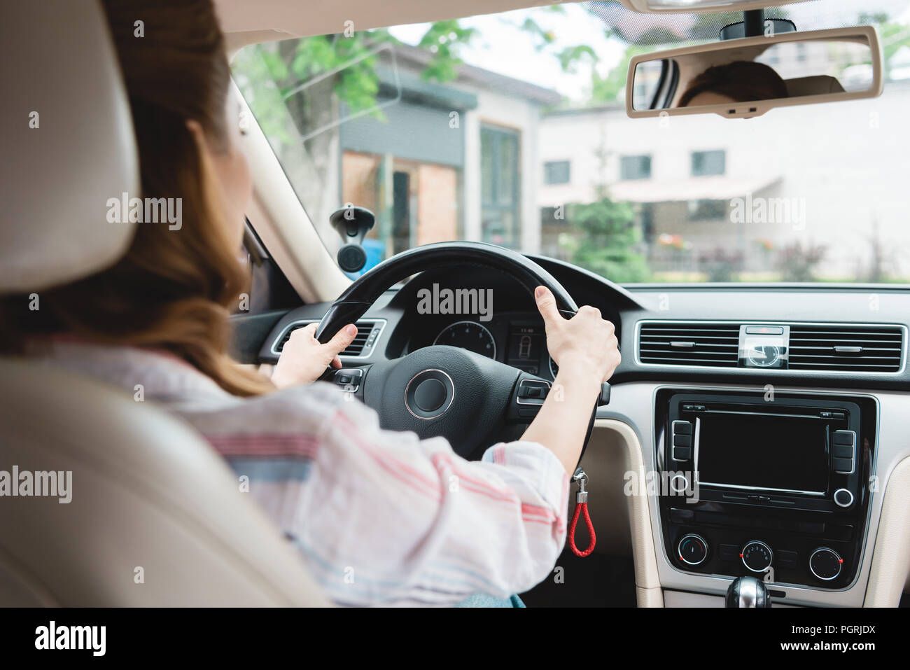 partial view of woman driving car alone Stock Photo - Alamy