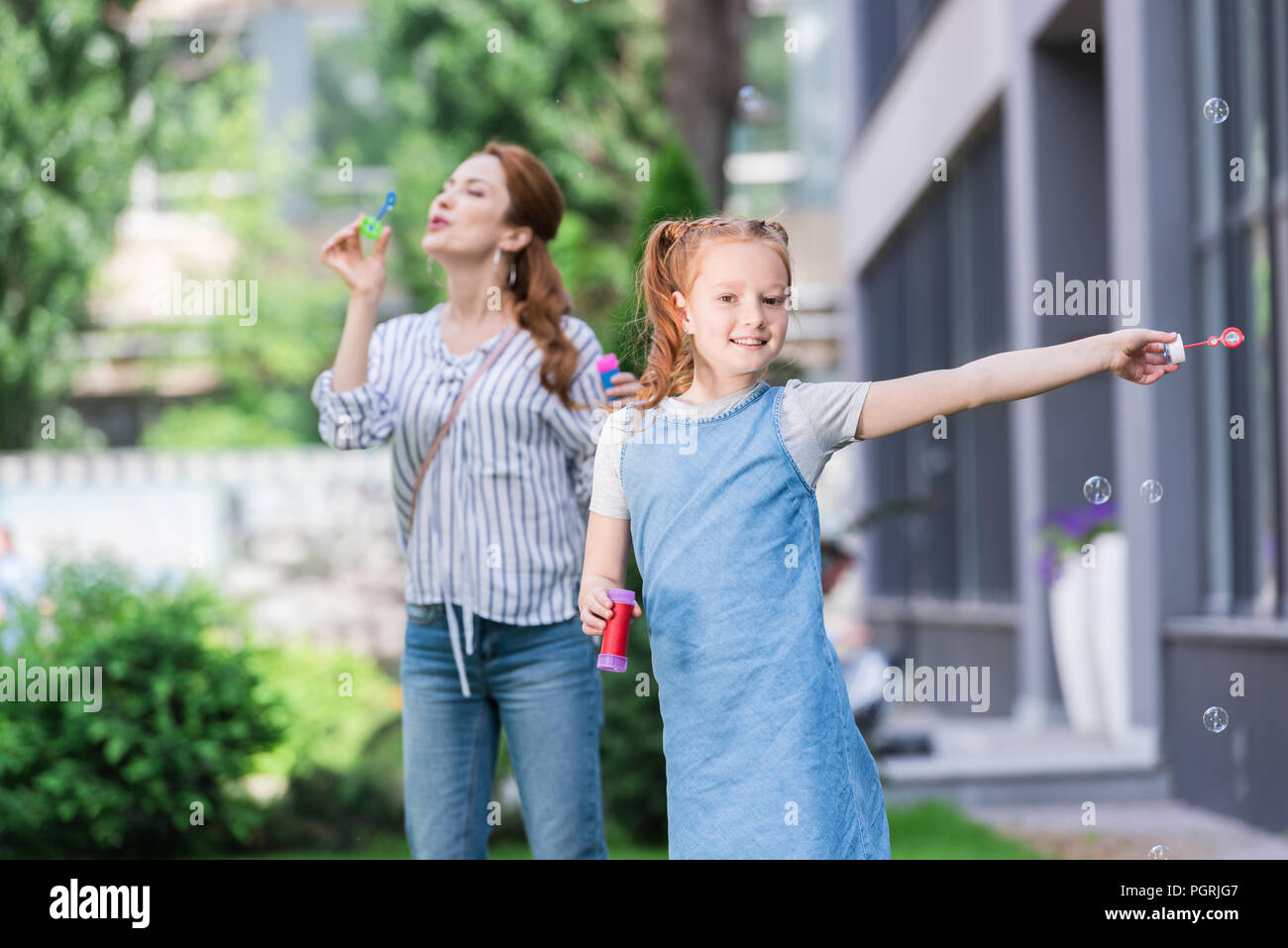 Mom daughter soap bubbles hi-res stock photography and images - Alamy