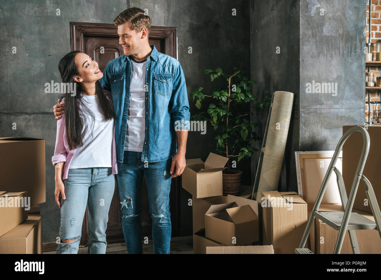 happy young couple moving into new home Stock Photo - Alamy