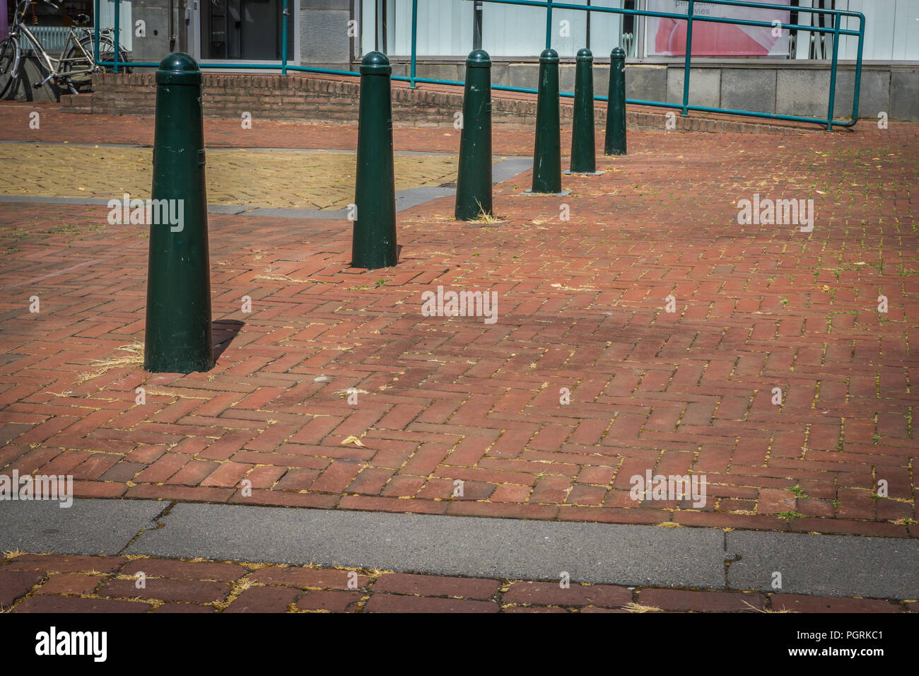 city landscape road with green poles and pattern pavement Stock Photo ...