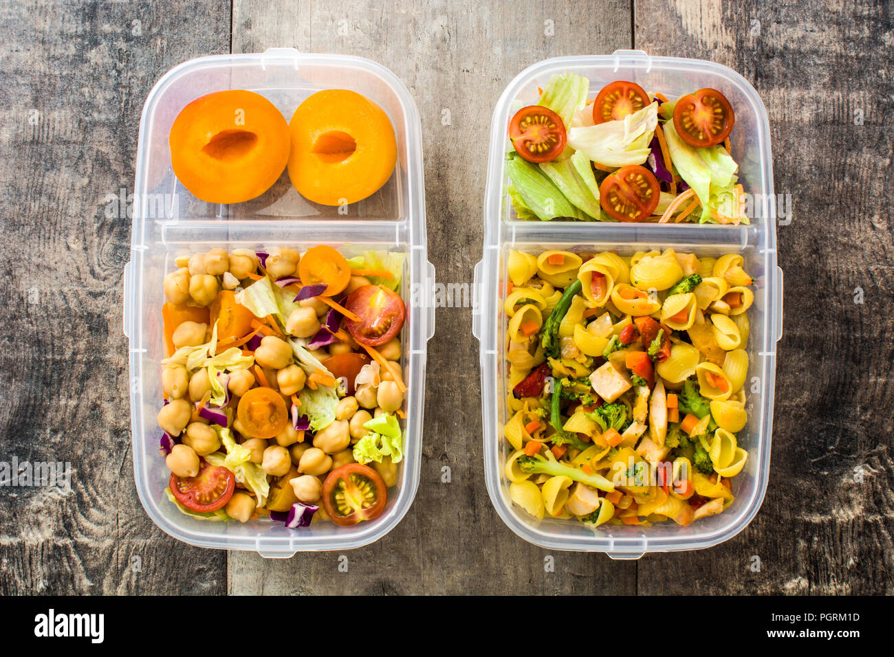 Lunch box with healthy food ready to eat on wooden table. Top view ...