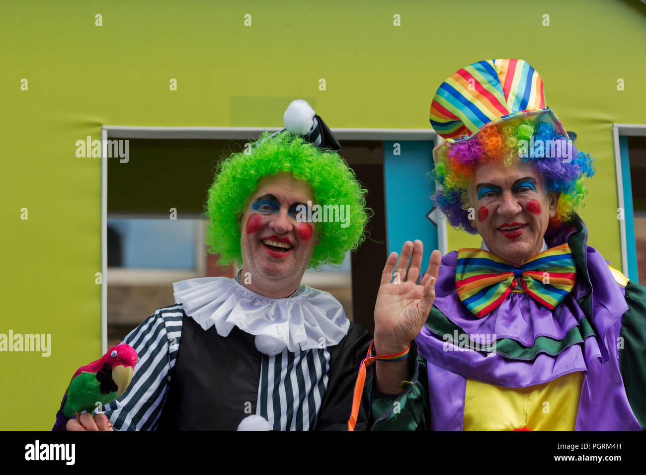 2 Men in clown costumes taking part in the 2018 Manchester Pride Parade ...