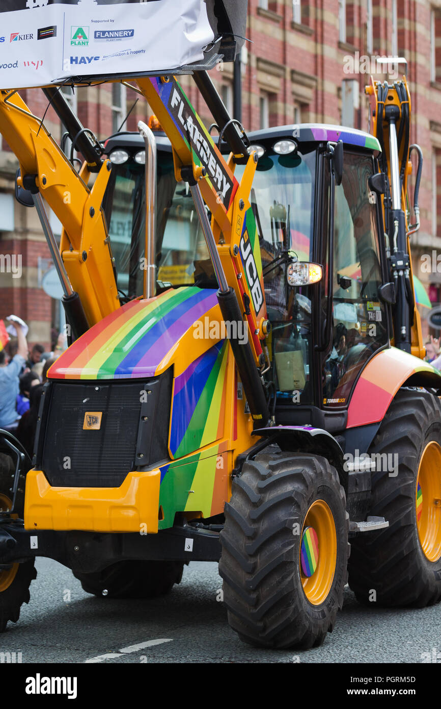 A JCB digger in rainbow colours taking part in the 2018 Manchester ...