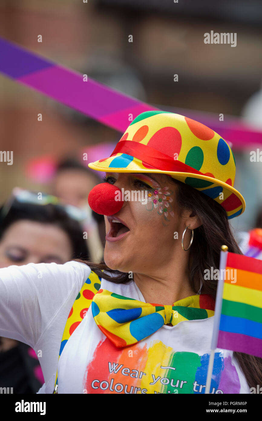 A woman dressed as a clown whilst taking part in the 2018 Manchester Pride Parade Stock Photo ...
