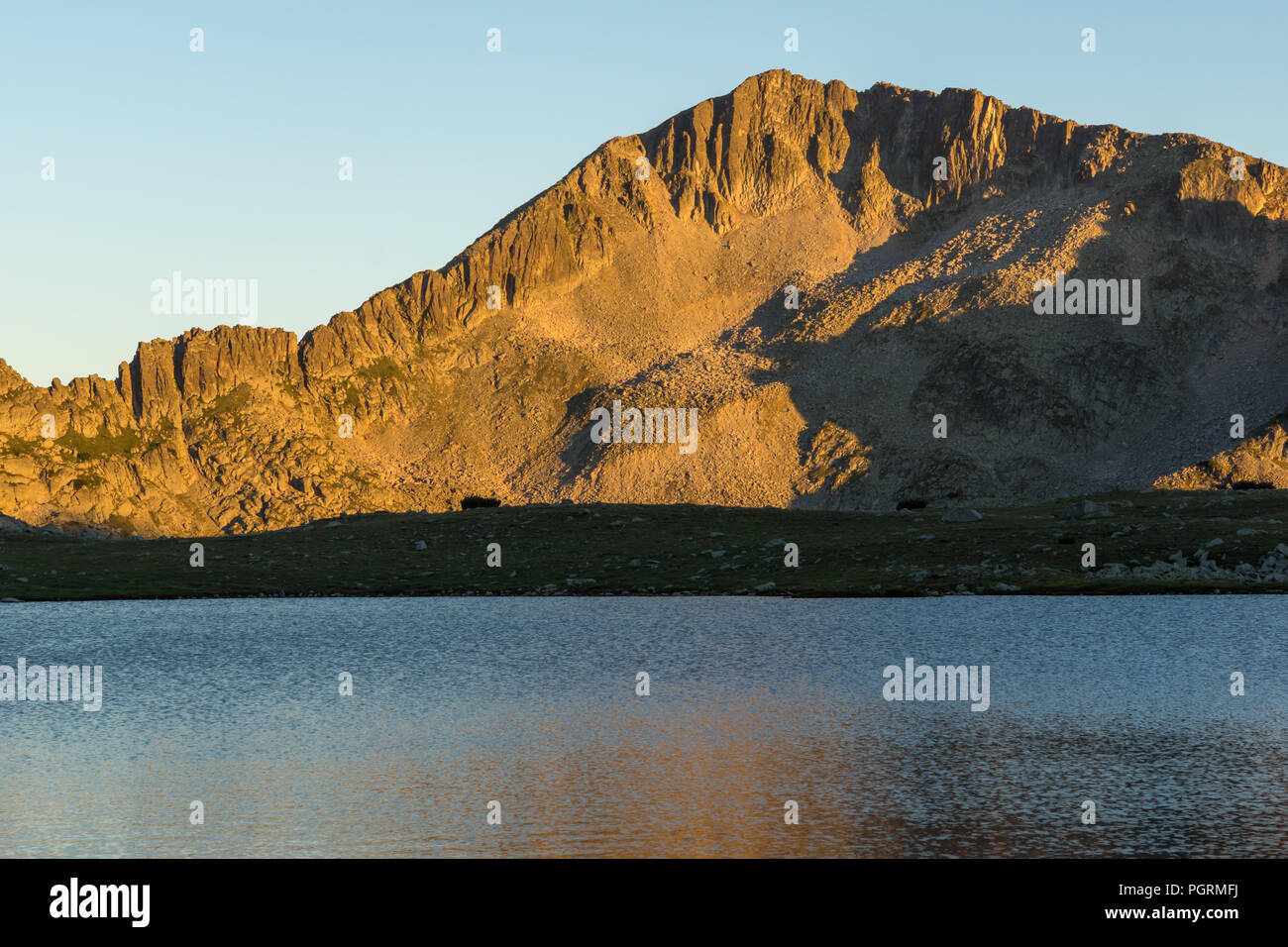 Sunset landscape with Kamenitsa peak and Tevno lake, Pirin Mountain ...