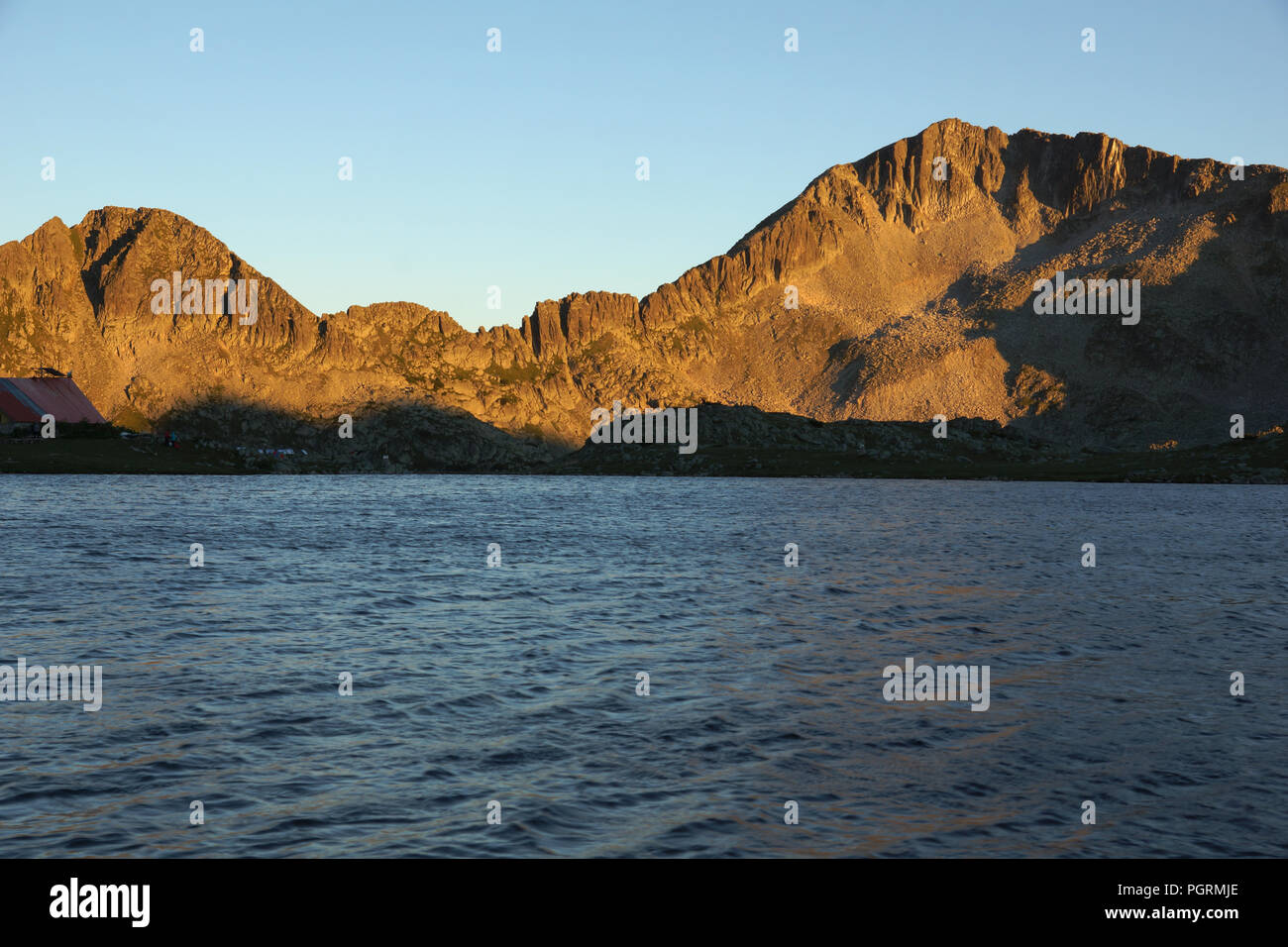 Sunset landscape with Kamenitsa peak and Tevno lake, Pirin Mountain ...