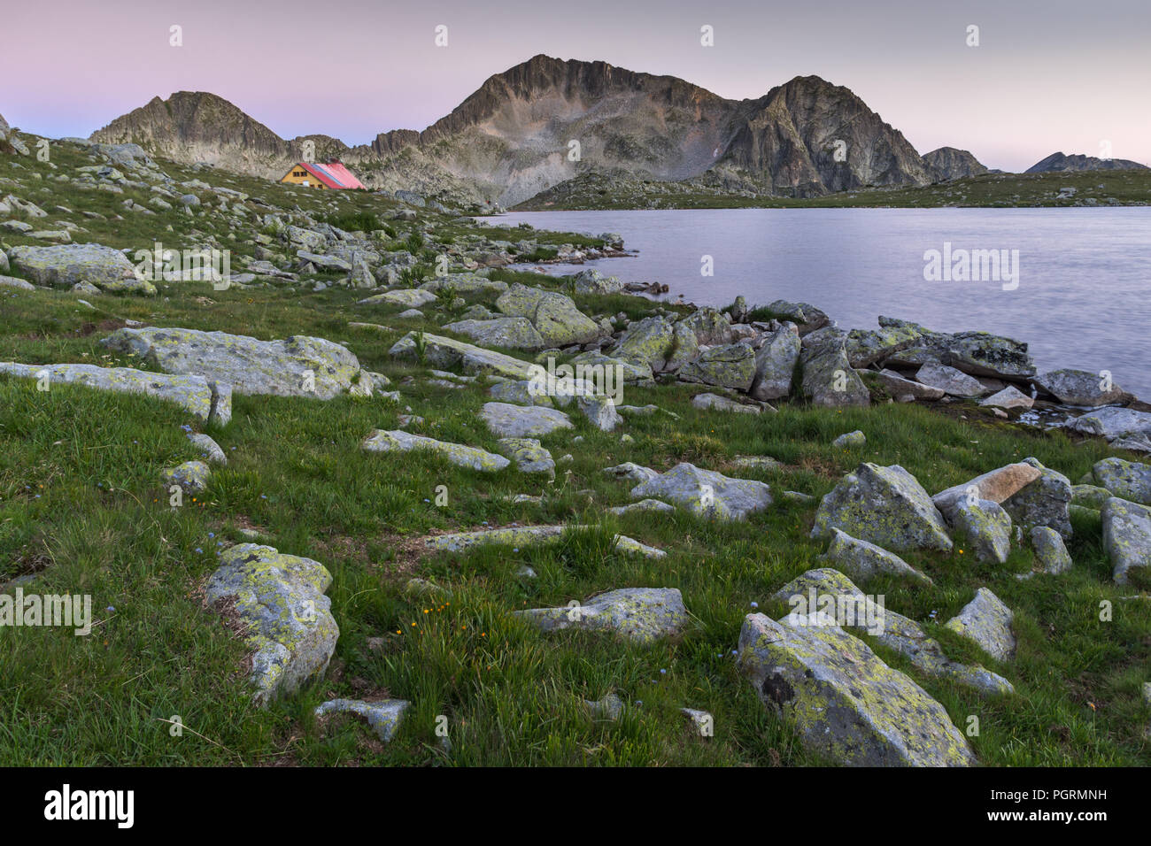 Sunset landscape with Kamenitsa peak and Tevno lake, Pirin Mountain ...