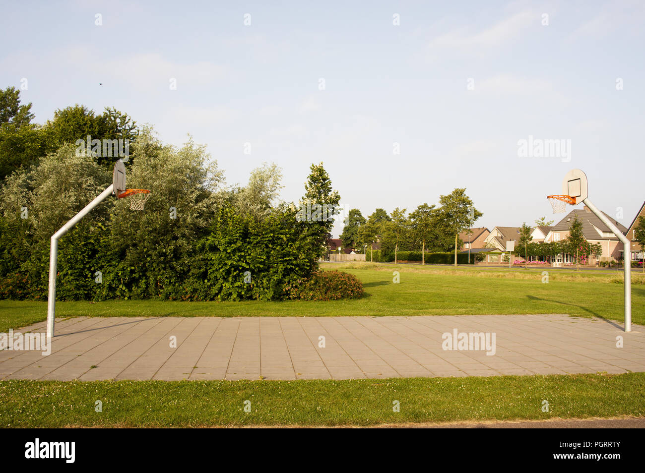 Outdoor basketball court with two baskets Stock Photo - Alamy