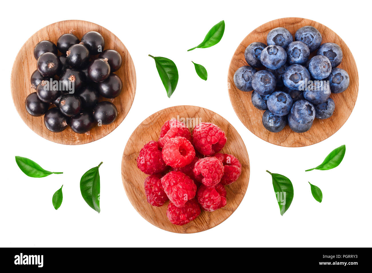 blueberry raspberry black currant in wooden bowl isolated on white ...