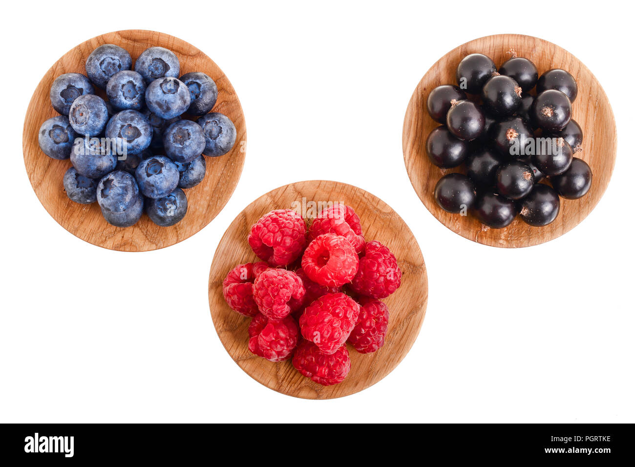 blueberry raspberry black currant in wooden bowl isolated on white ...