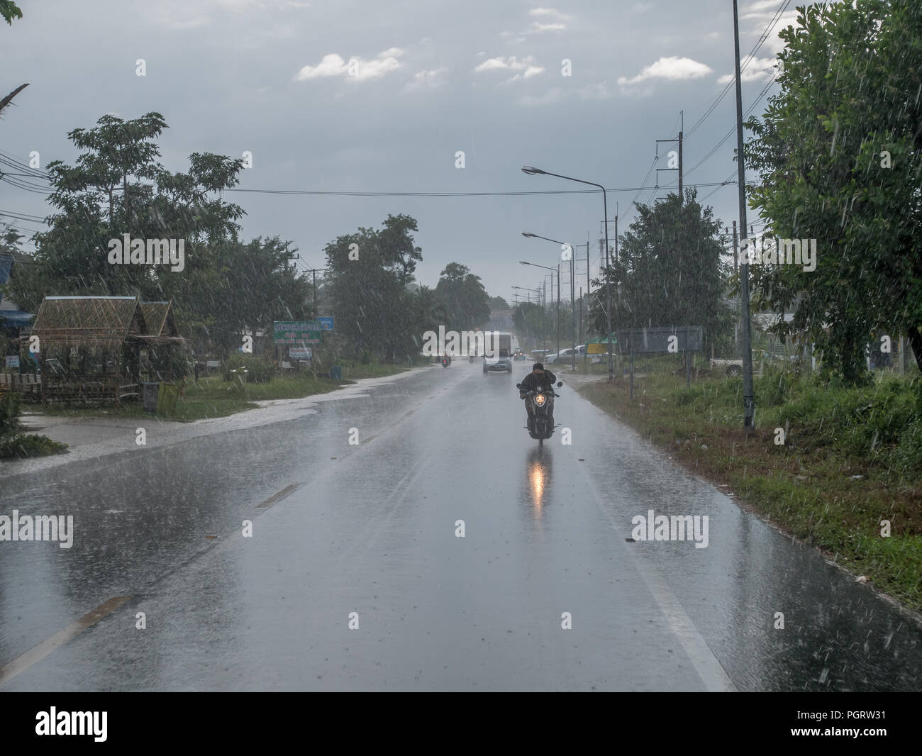 Bangkok moped rain hi-res stock photography and images - Alamy