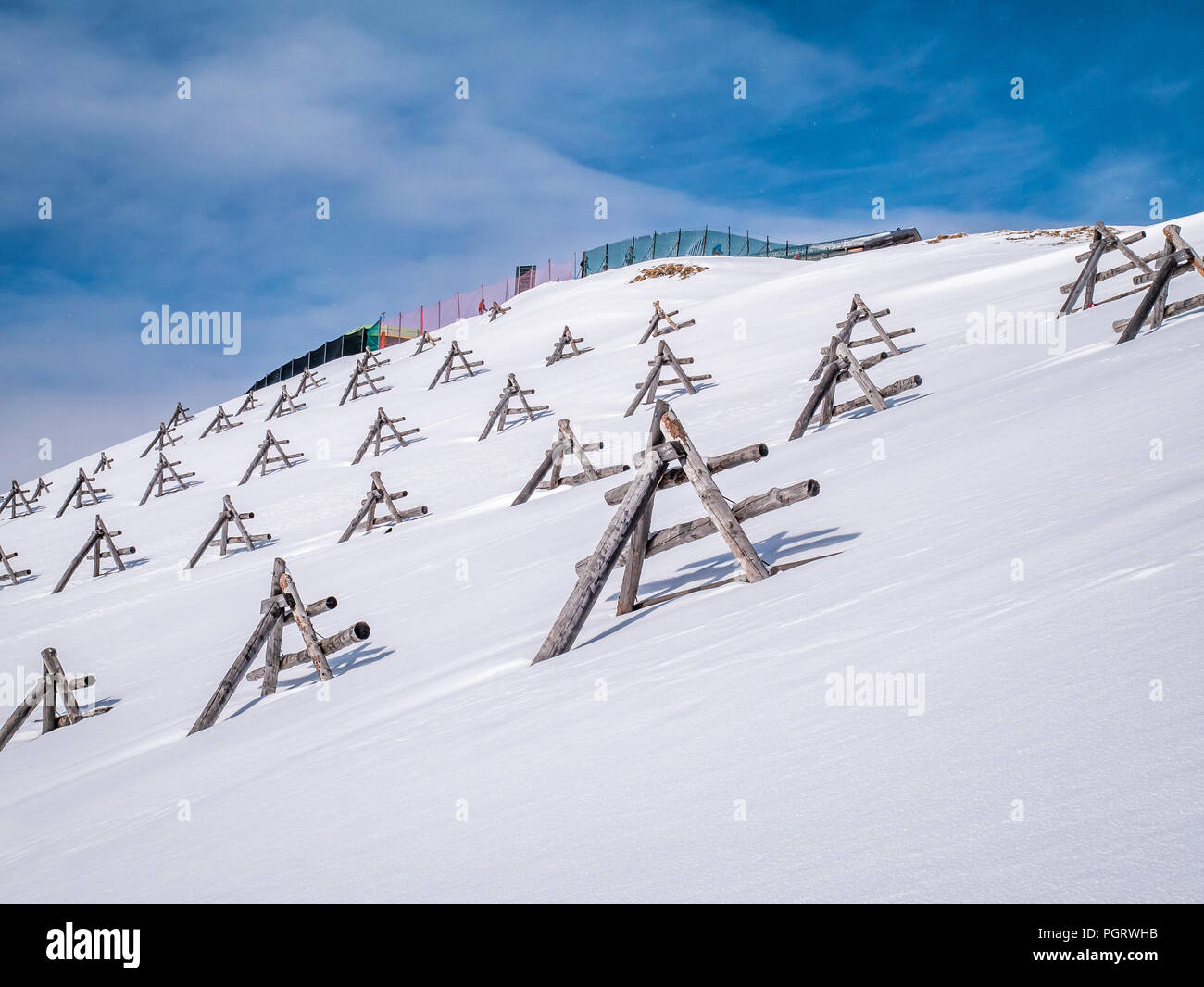 Avalanche barrier or protection made by wood in ski slope Stock Photo ...