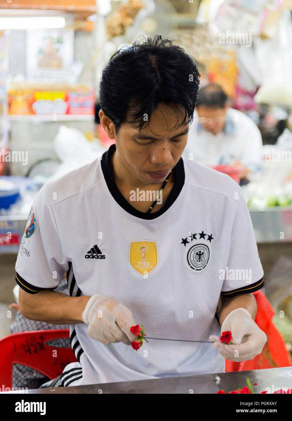 Threading flowers hi-res stock photography and images - Alamy