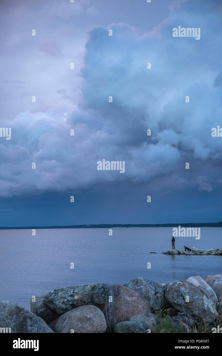 Sunset at the sea. It's raining Stock Photo - Alamy