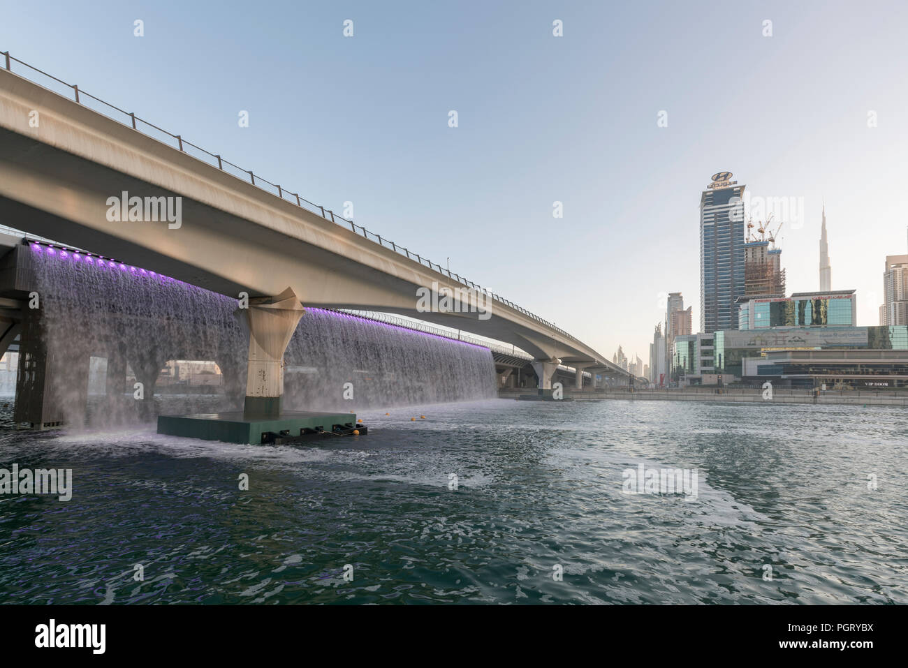 The Dubai Water Canal waterfall during the day, Dubai, United Arab ...