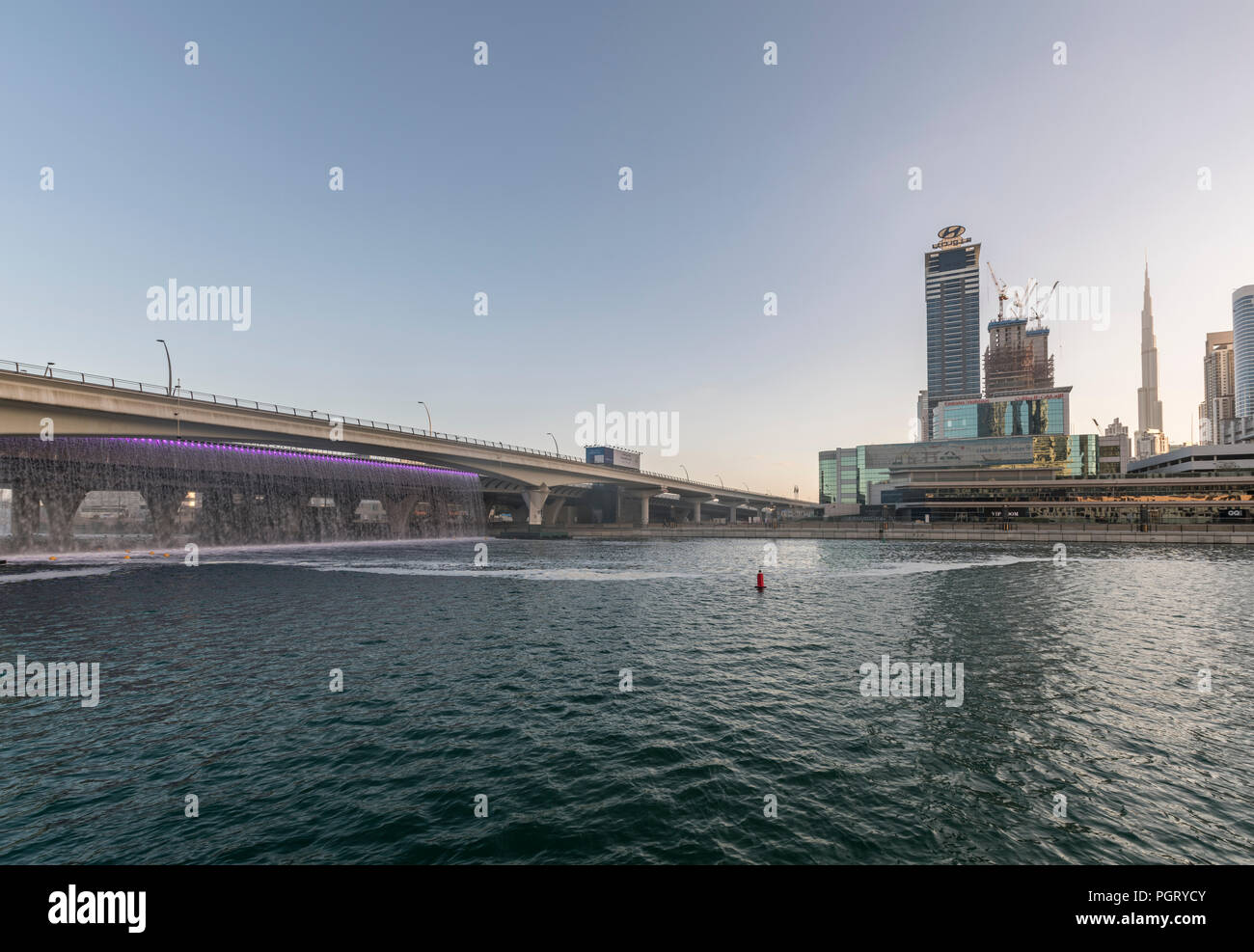 The Dubai Water Canal waterfall during the day, Dubai, United Arab ...