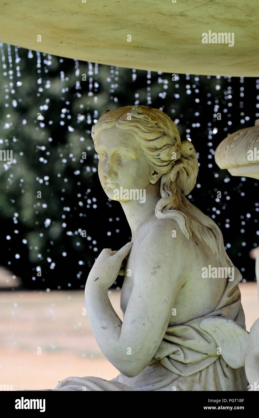 Girl under statue hi-res stock photography and images - Alamy