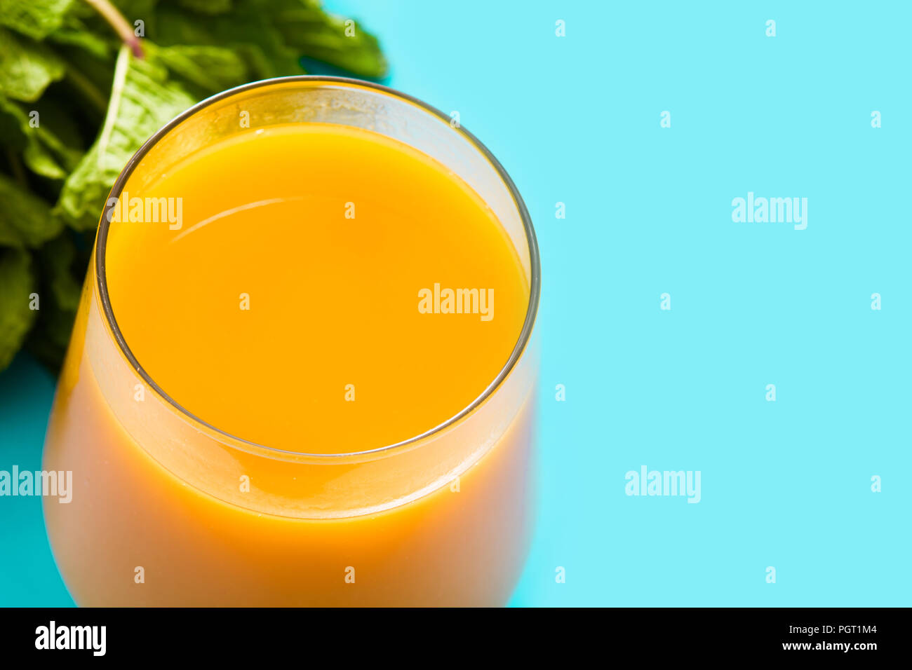 Mango Lassi dessert. Traditional Indian drink on blue background ...