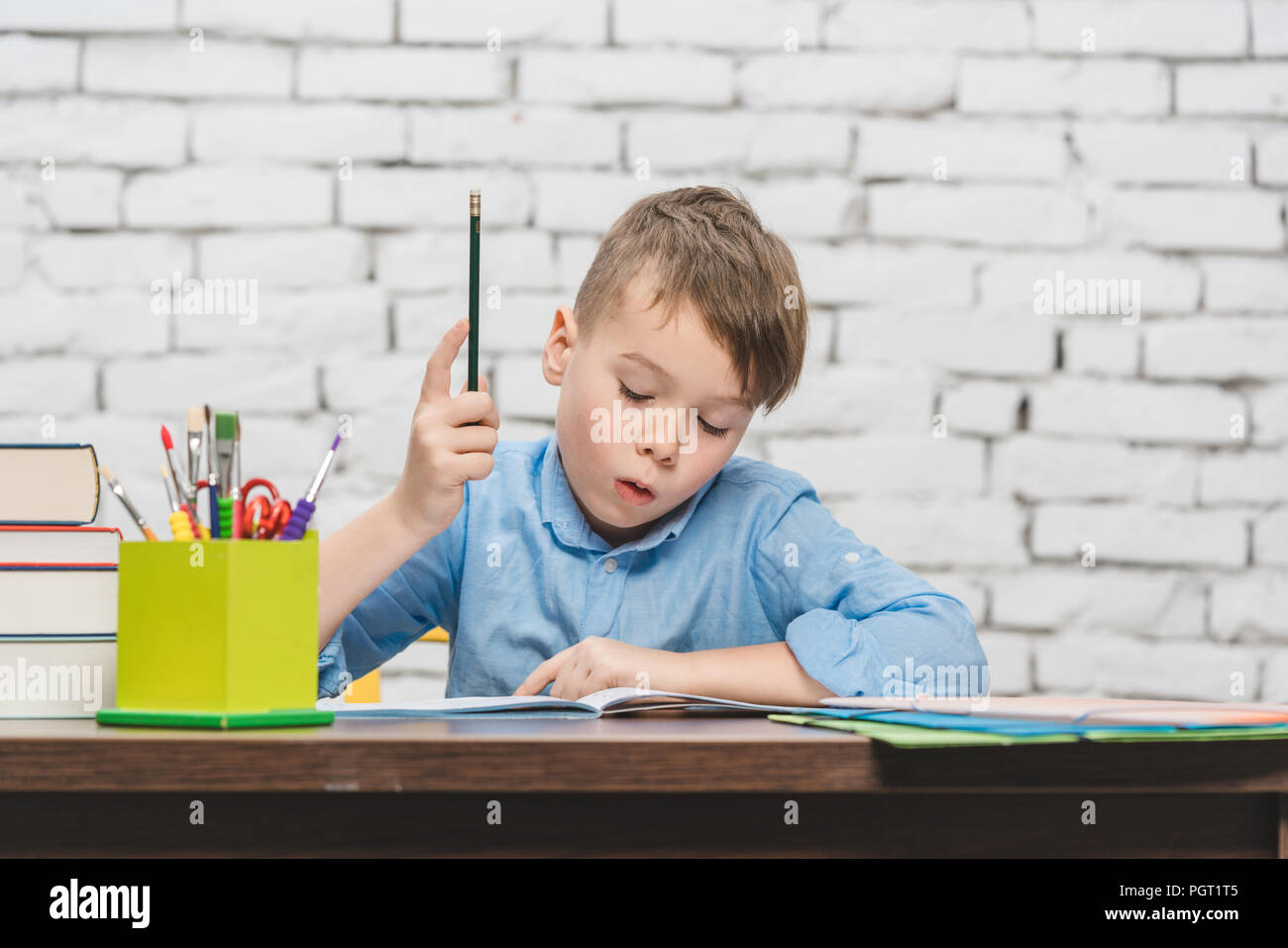 Boy pupil doing homework school hi-res stock photography and images - Alamy