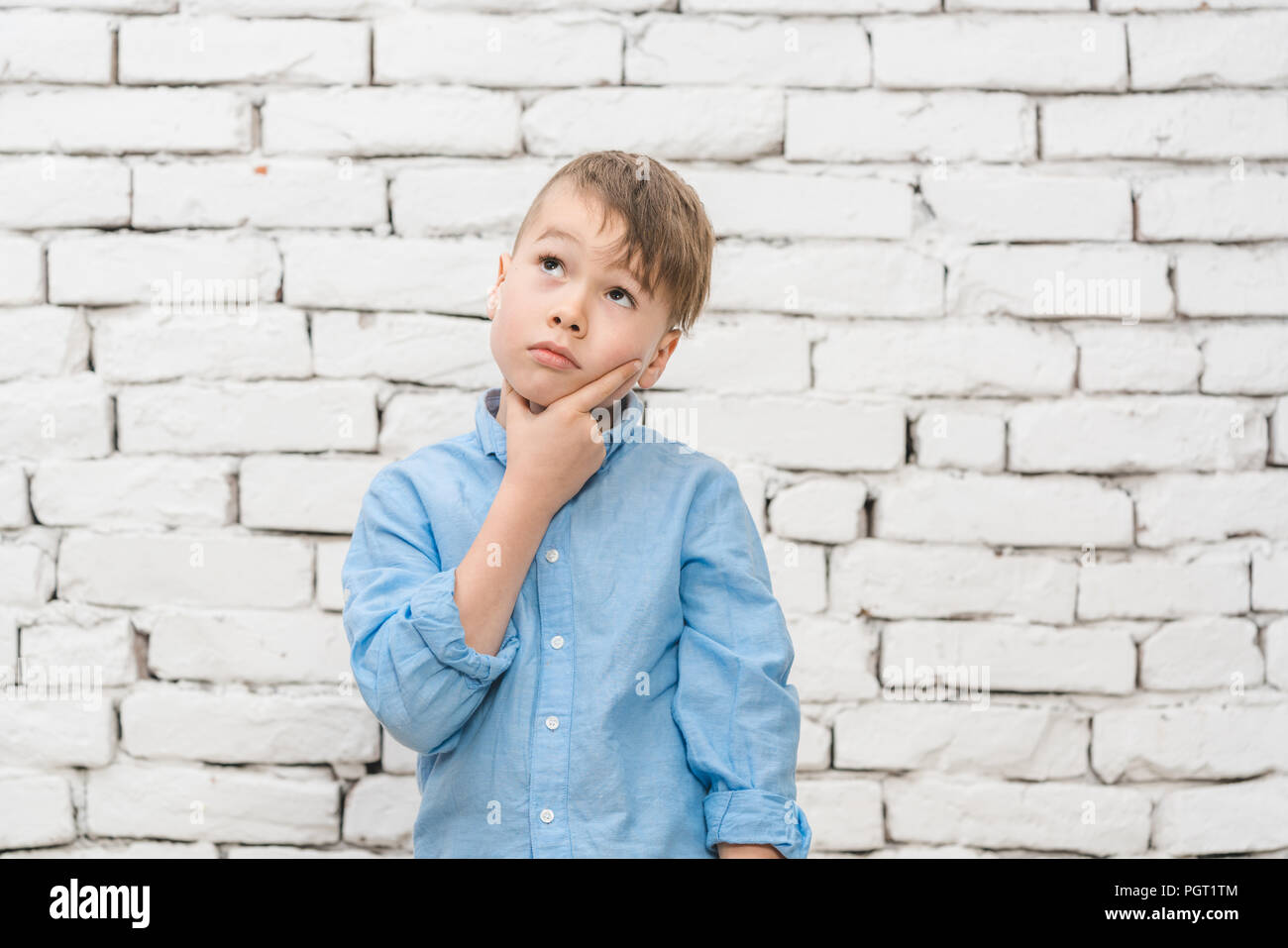 Pensive student thinking hard Stock Photo - Alamy