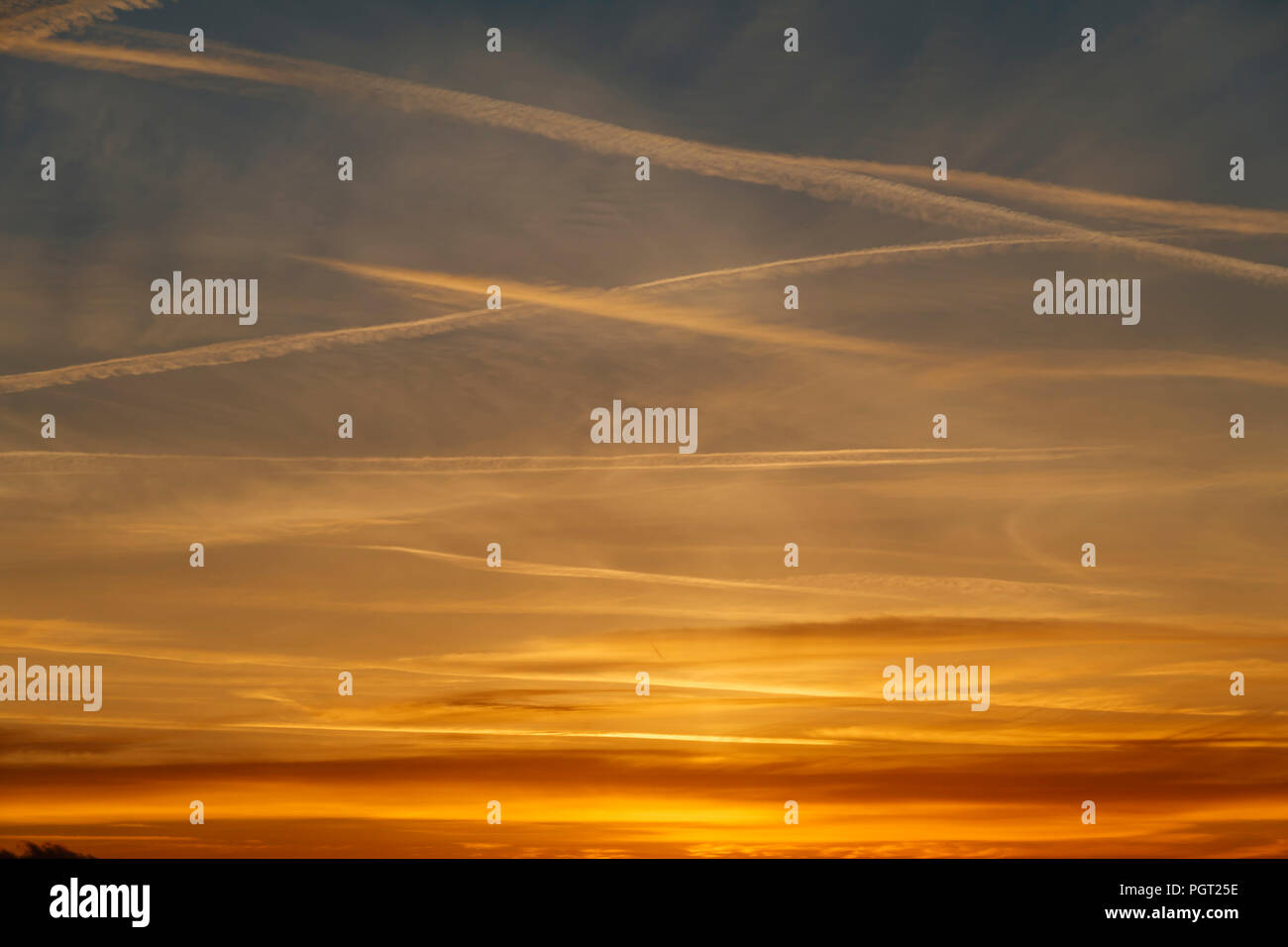 Blue sky with contrails Stock Photo - Alamy