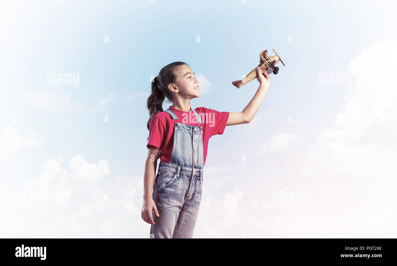 Concept of careless happy childhood with girl dreaming to become Stock ...