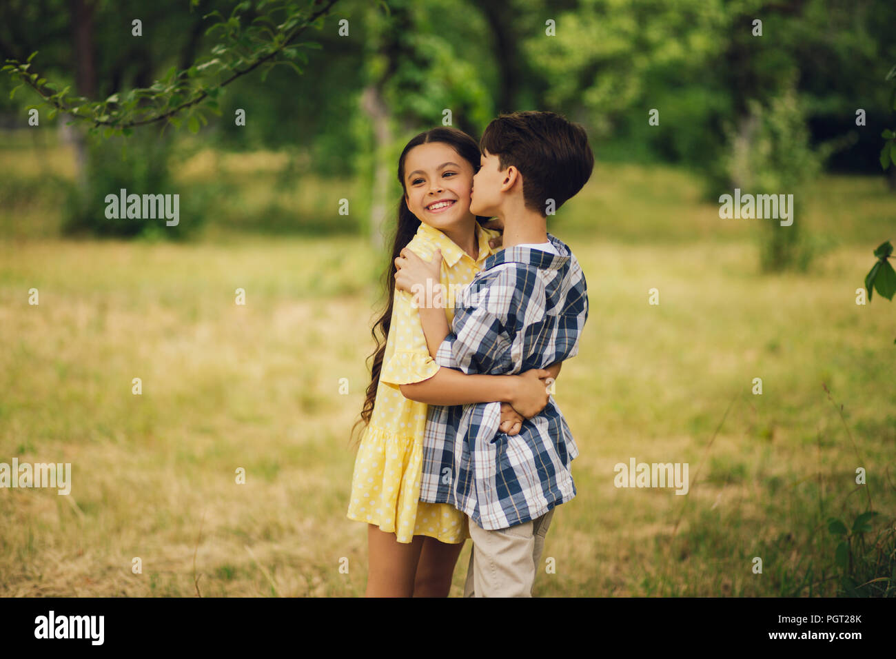 Little kids hugging Stock Photo - Alamy