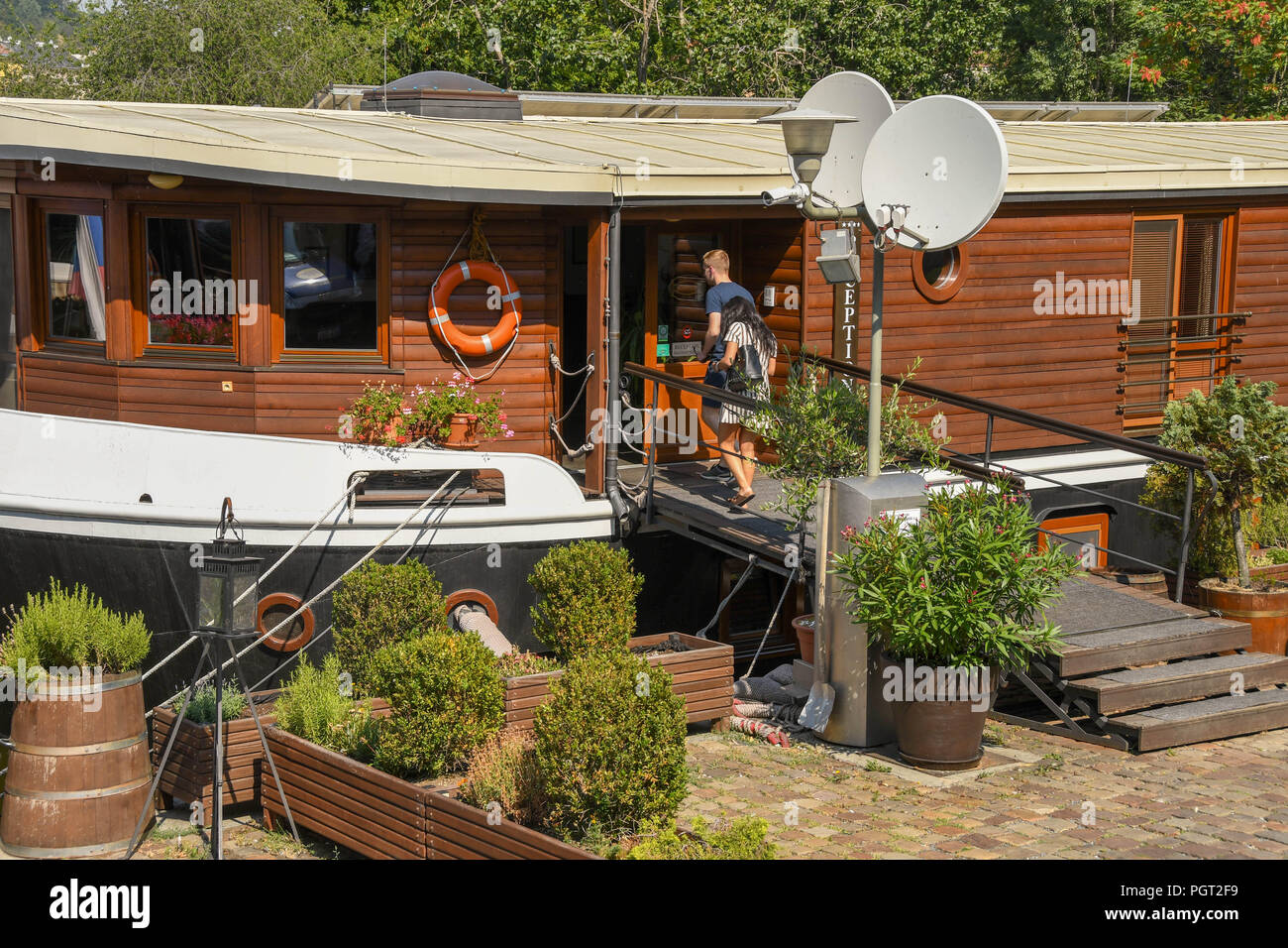 Close up view of two people entering the floating hotel "Botel Matylda ...