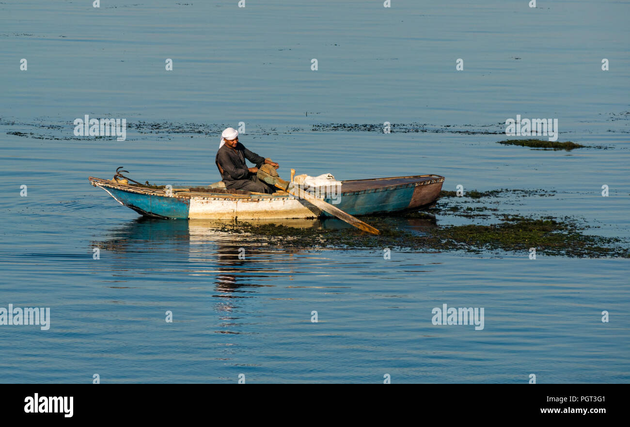 Old man rowing boat hi-res stock photography and images - Alamy