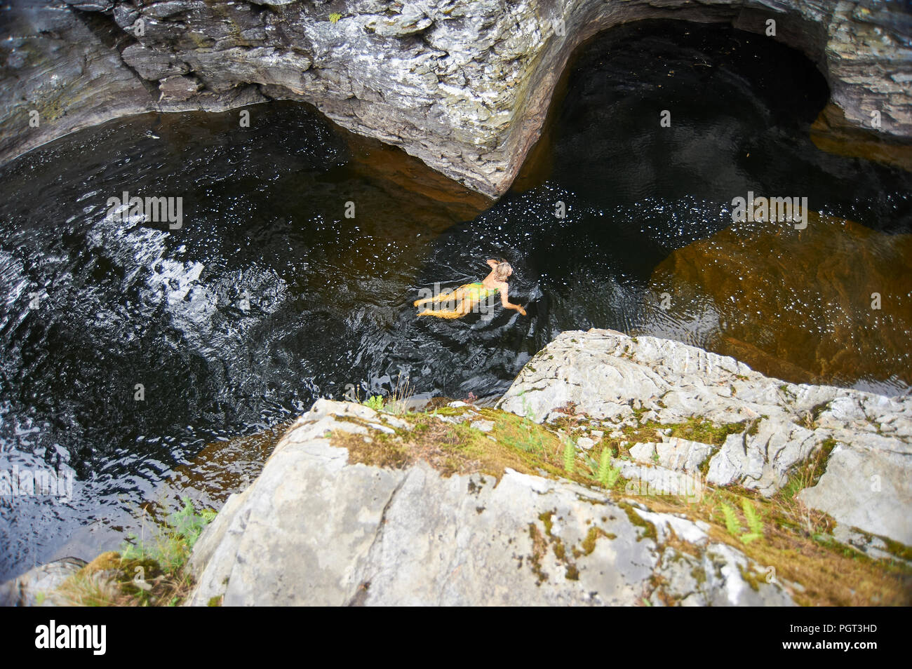 A Woman Wild Swimming in the river Dee, The Linn of Dee Gorge and ...