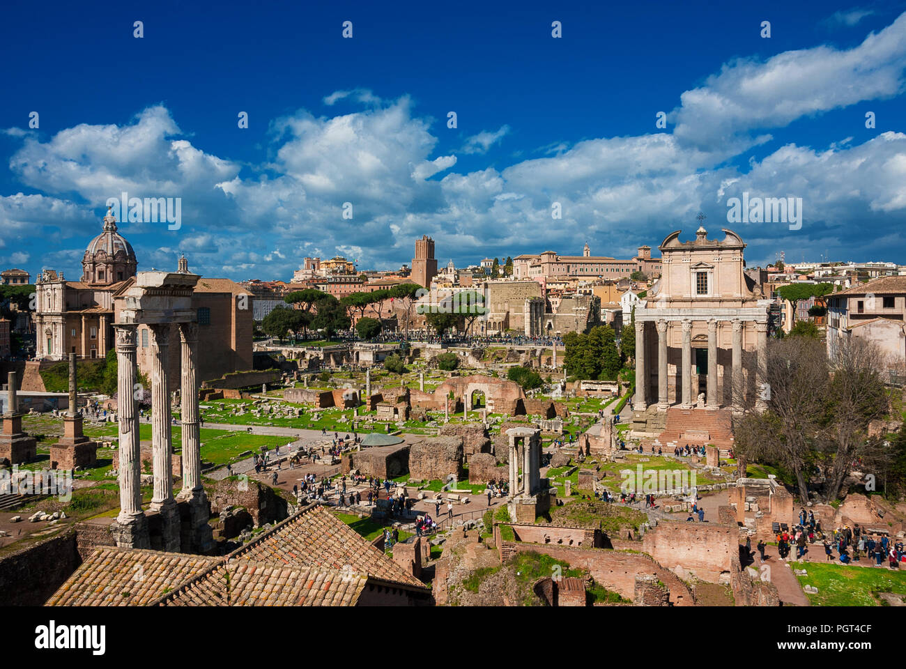 Sightseeing in Rome. Tourists visit Roman Forum ancient ruins Stock ...