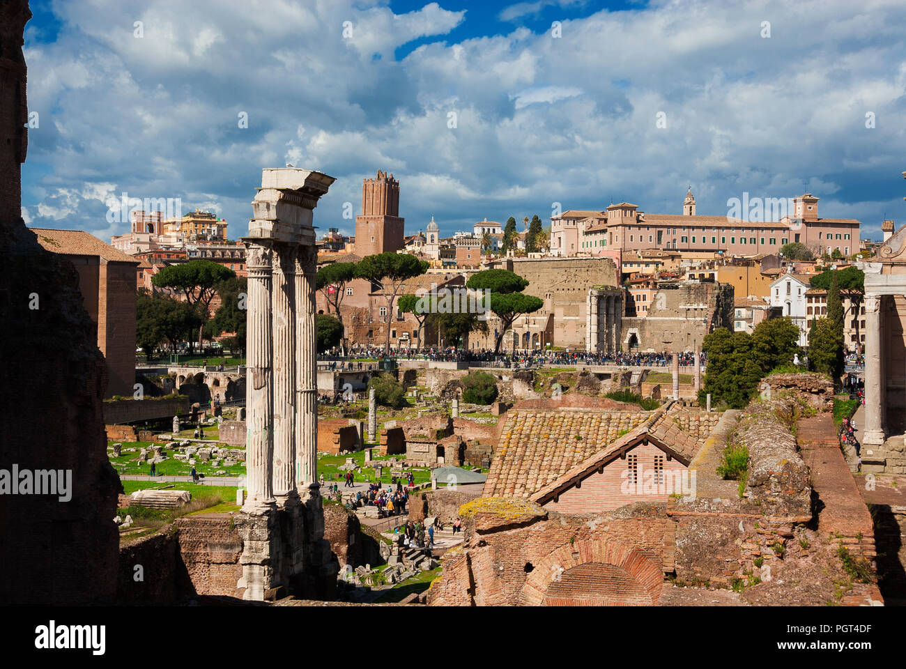 Sightseeing in Rome. Tourists visit Roman Forum ancient ruins Stock ...