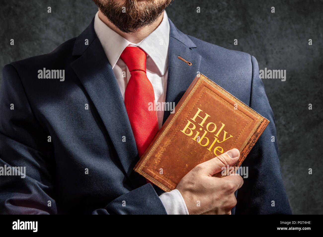 Man holding bible hi-res stock photography and images - Alamy
