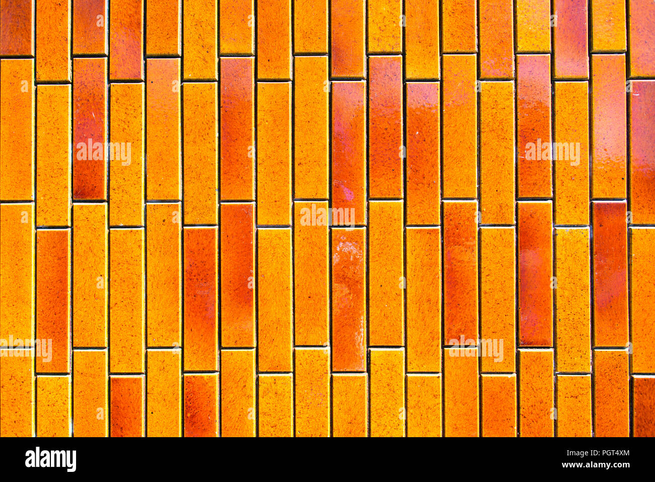A view of porcelain ceramic tiles in orange color Stock Photo - Alamy