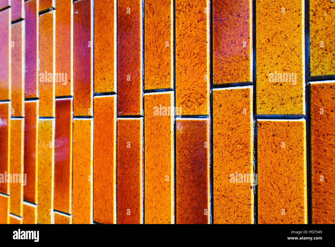 A view of porcelain ceramic tiles in orange color Stock Photo - Alamy