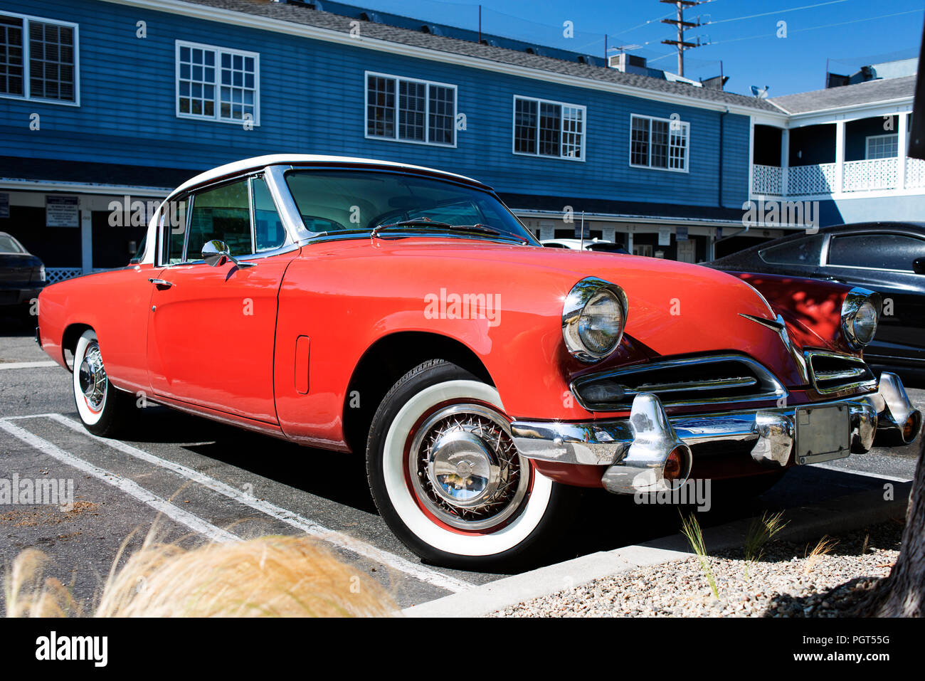 A view of a rare classic vintage American car in a parking lot Stock ...