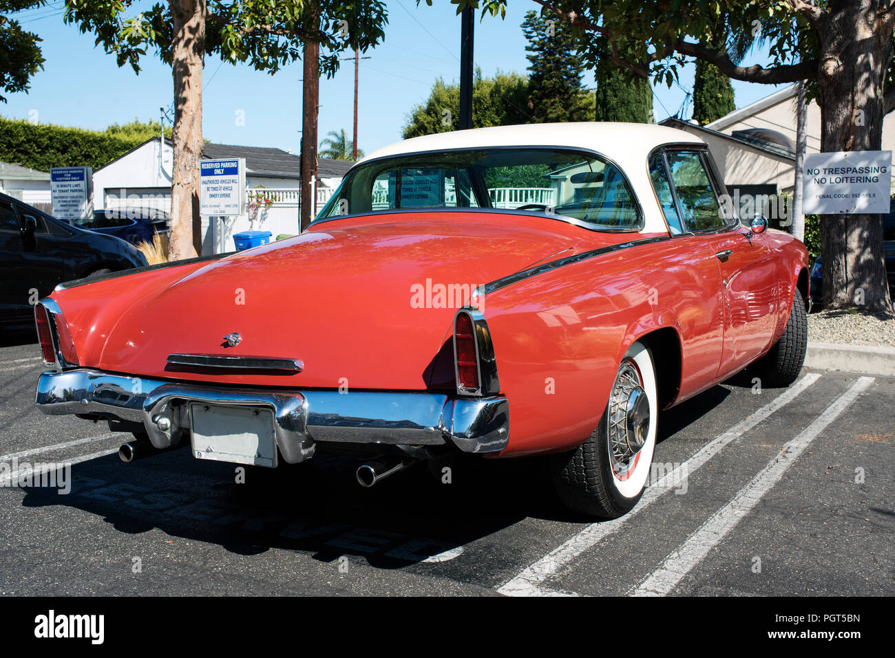 A view of a rare classic vintage American car in a parking lot Stock ...