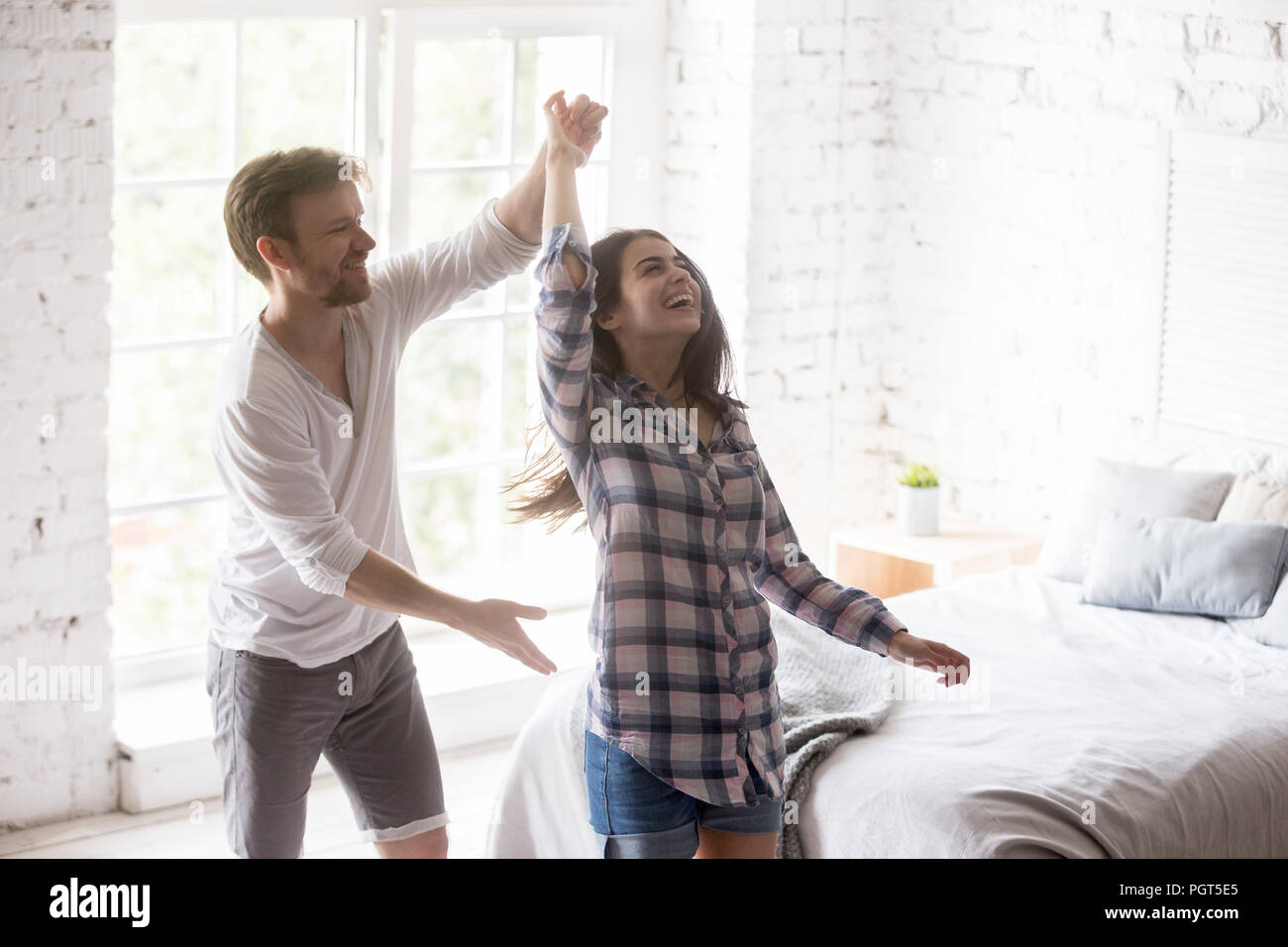 Happy couple dancing having fun at home Stock Photo - Alamy