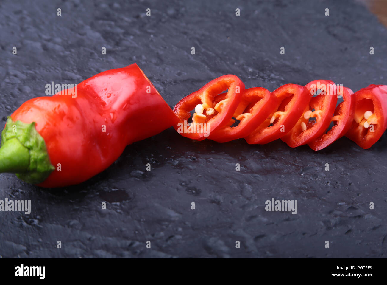 CloseUp top view red chili pepper with sliced, raw food ingredient ...