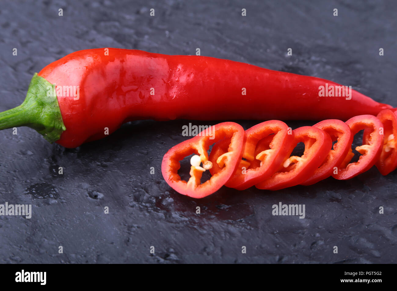 CloseUp top view red chili pepper with sliced, raw food ingredient ...