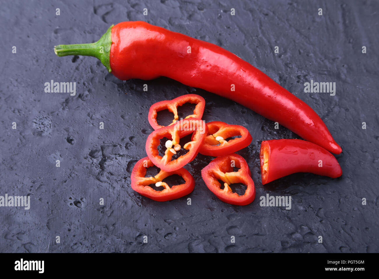CloseUp top view red chili pepper with sliced, raw food ingredient ...